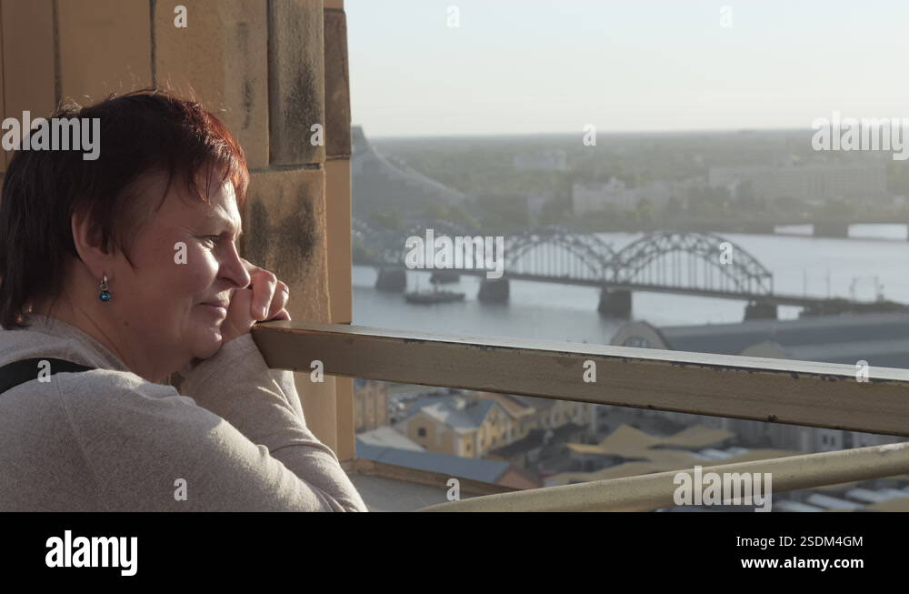 A lady looking at the panoramic sight of the river in Riga Latvia Stock ...