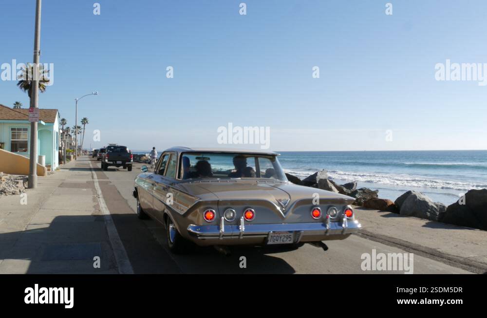 People walking, waterfront promenade beachfront boardwalk. Ocean beach ...