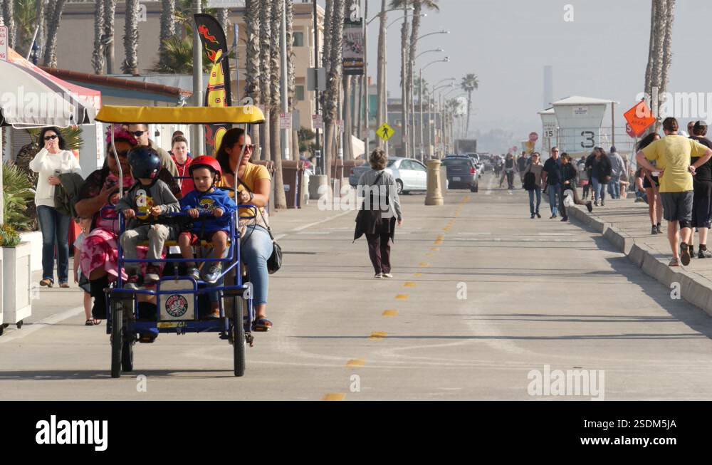 People walking, waterfront promenade beachfront boardwalk. Ocean beach ...