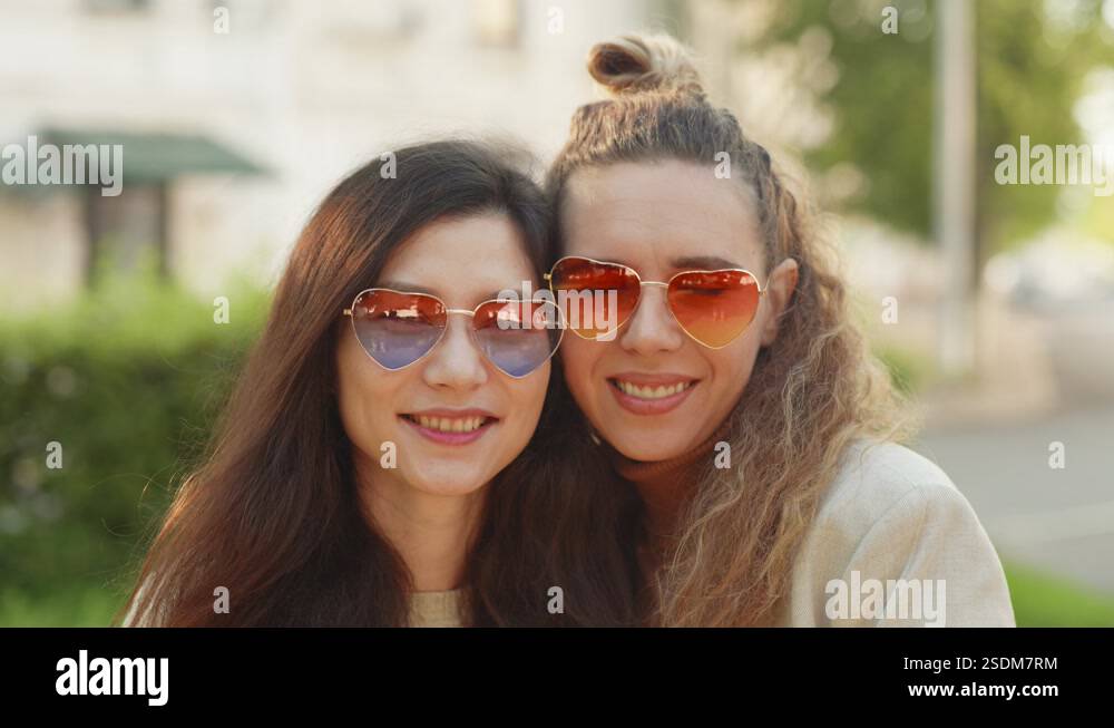 Best friends girls hug, smile and show positive face emotions. Portrait ...