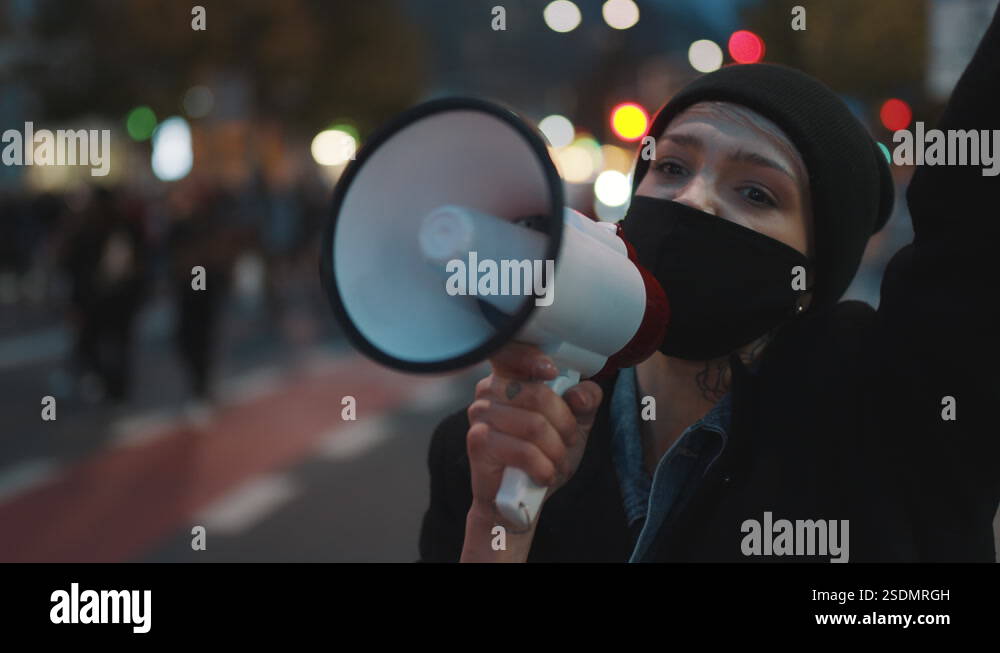Demonstrations against covid-19 lockdown measures. Young woman with ...