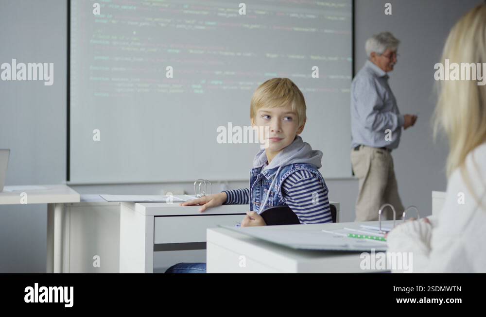 Boy asking questions to classmate during code explanation Stock Video ...