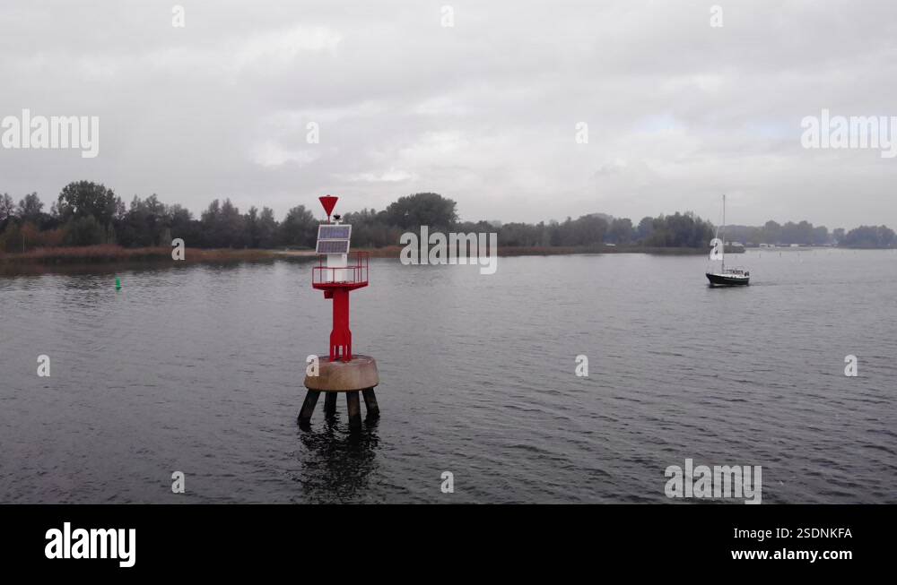 Pleasure yacht sailing without sails on a Dutch fairway on the right ...