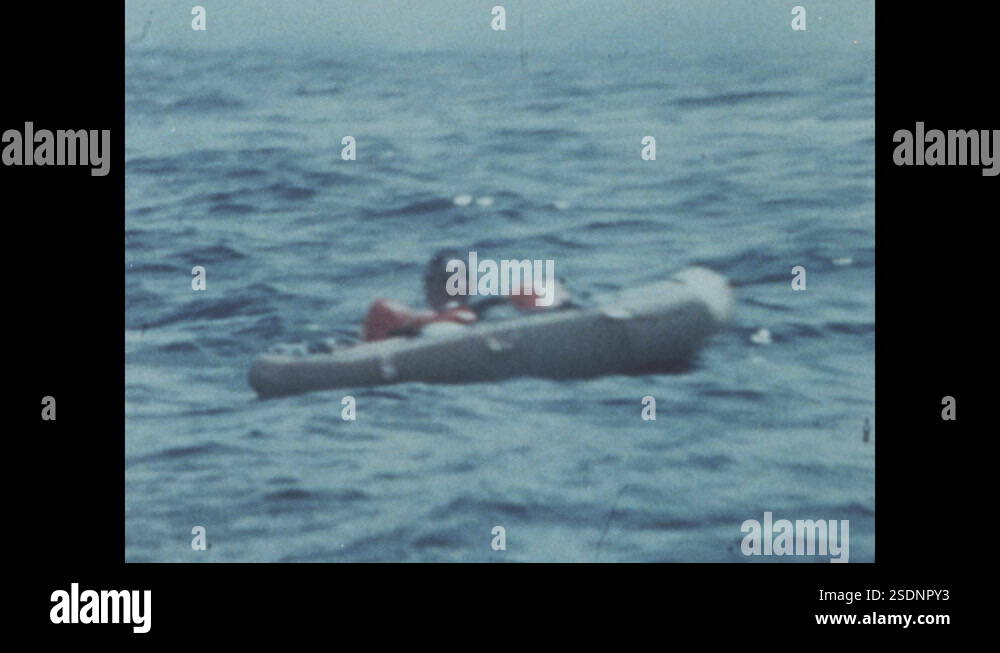 1960s: Aircraft skims water. Man floats next to inflatable raft. Map of ...