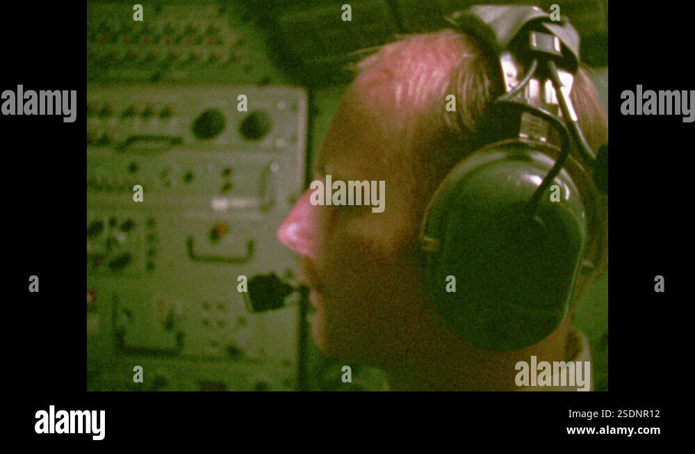 1970s: men at controls reading information and equipment relayed from ...