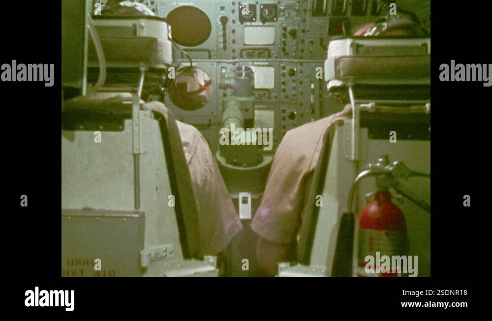 1970s: men at controls reading information and equipment relayed from ...