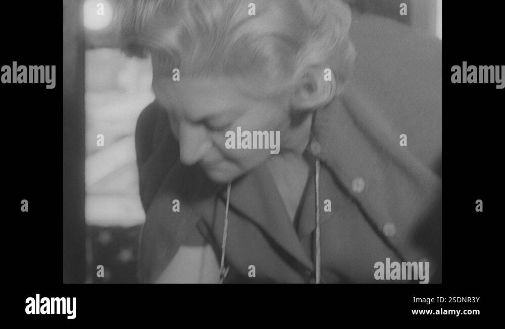 1960s: Polling place. Man enters building. Voting booth. Trolley. City ...