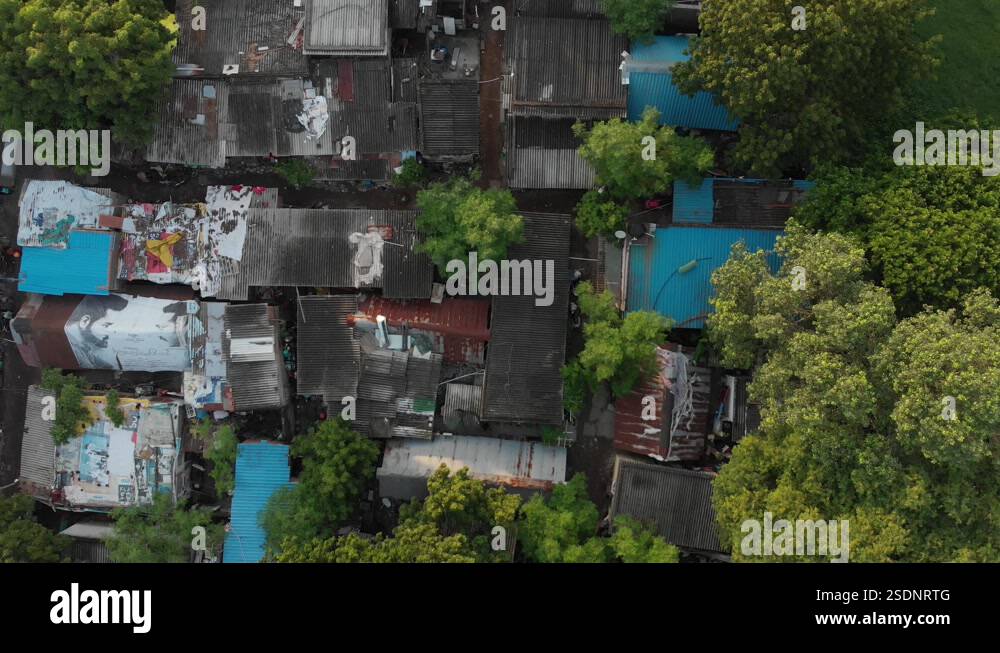 Ascending top view of poor suburbs with old destroyed housing area ...