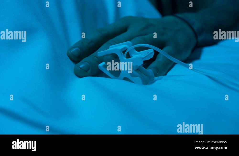 Male hand with equipment connected to the finger in the laboratory ...
