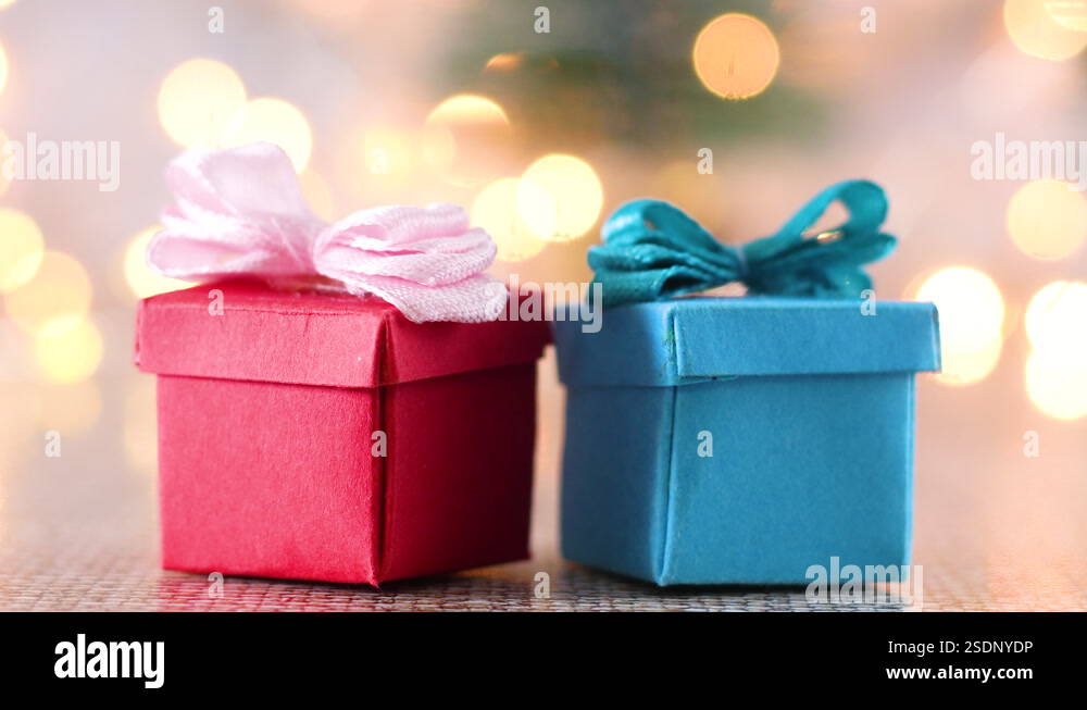Red and blue mini Christmas gifts with blinking lights behind Stock ...