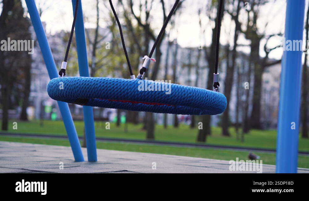 Swings on empty playground during lockdown Stock Video Footage - Alamy