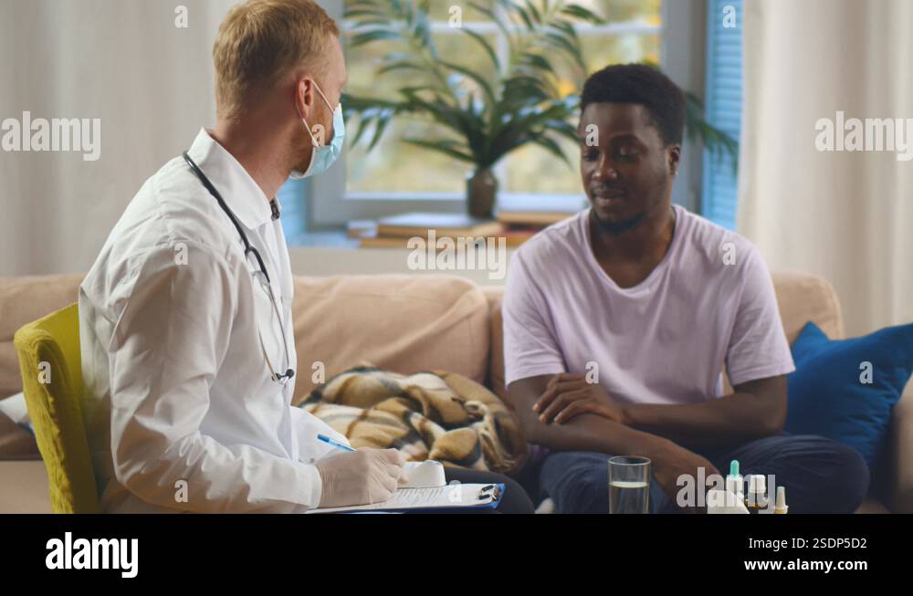 Doctor recording patient information during home visit Stock Video ...