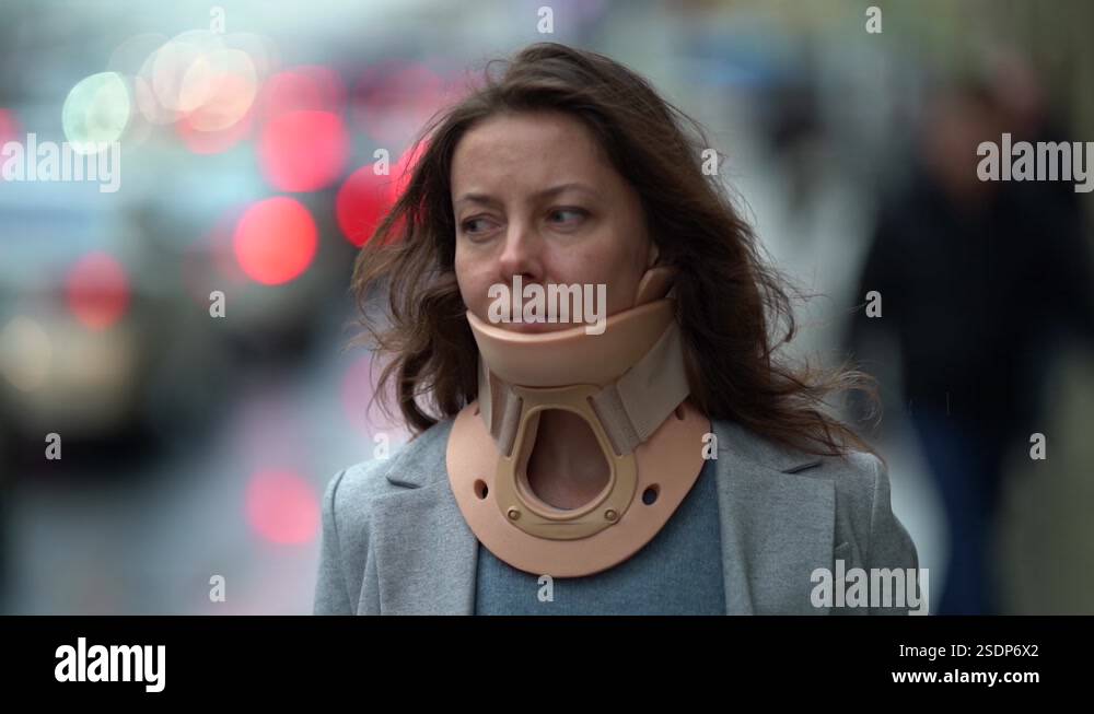 portrait of an adult woman with a medical neck brace to treat a neck ...