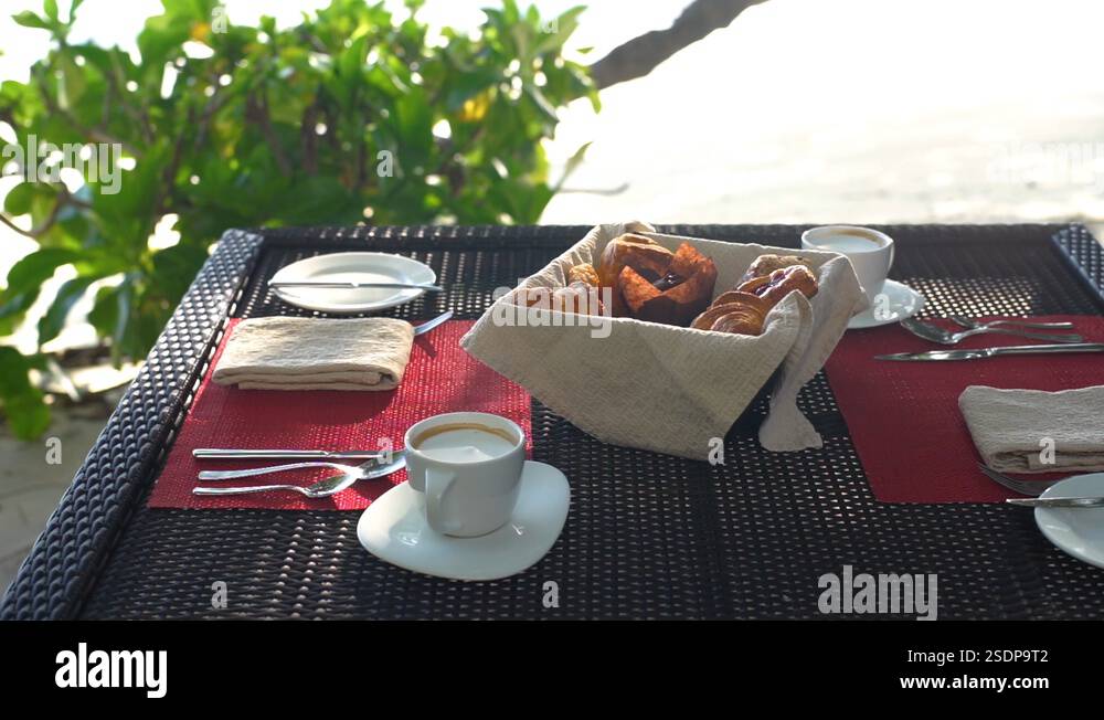 Linear dolly of breakfast table on beach early morning at seaside ...