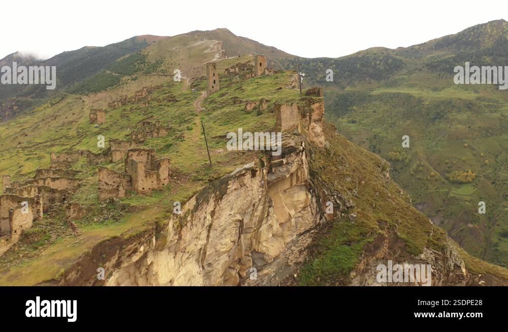 Ancient towers and Ruins of the abandoned village on a cliff. Ruins of ...