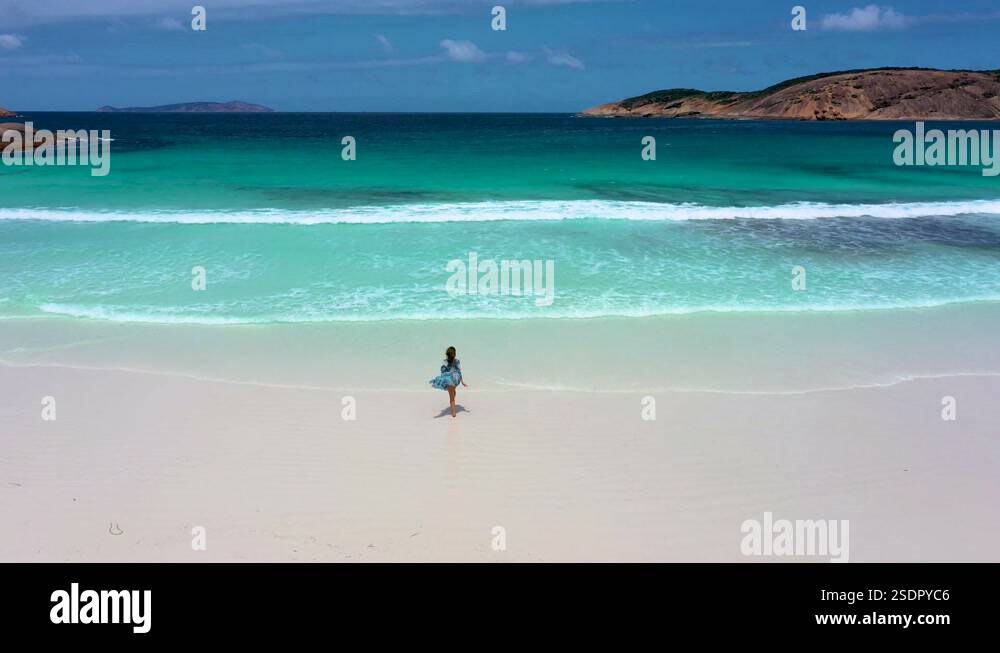 "Girl in a summer dress is running into Hellfire bay near Esperance ...