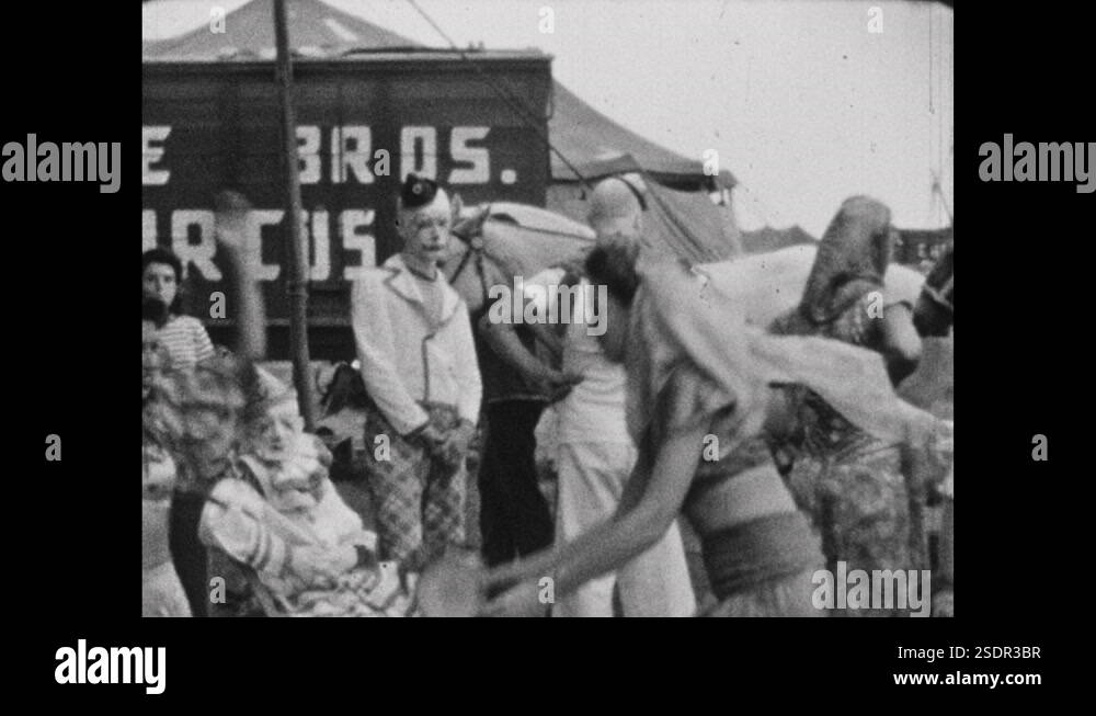 1940s: Circus clowns, riders, performers in exotic costumes mingle by ...