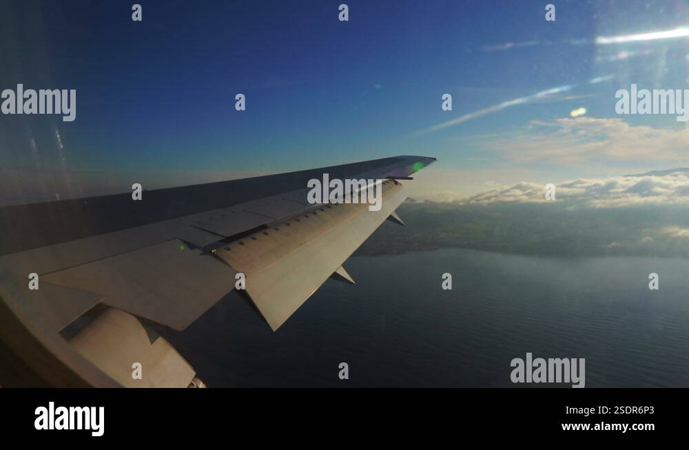 Airplane wing with São Migel's island in the Azores on the background ...