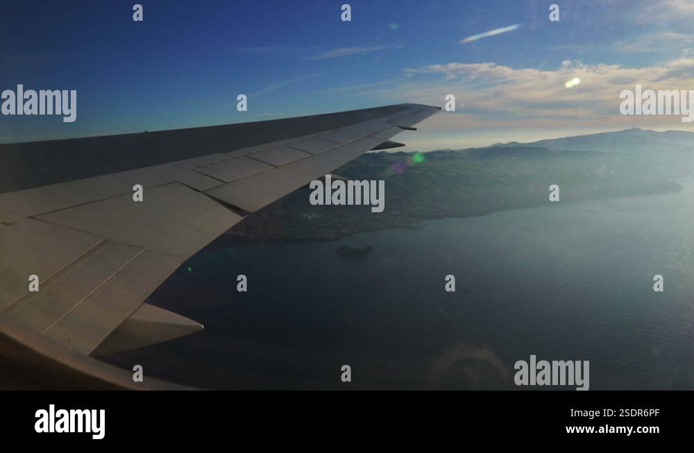 Airplane wing with São Migel's island in the Azores on the background ...