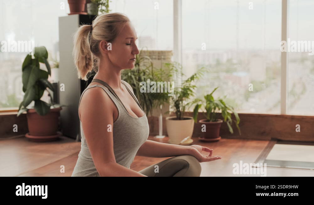 Woman Meditating Alone Stock Video Footage - Alamy