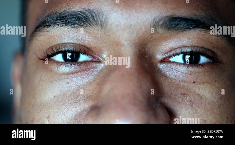 African man eyes close-up, black guy macro eye closeup staring camera ...