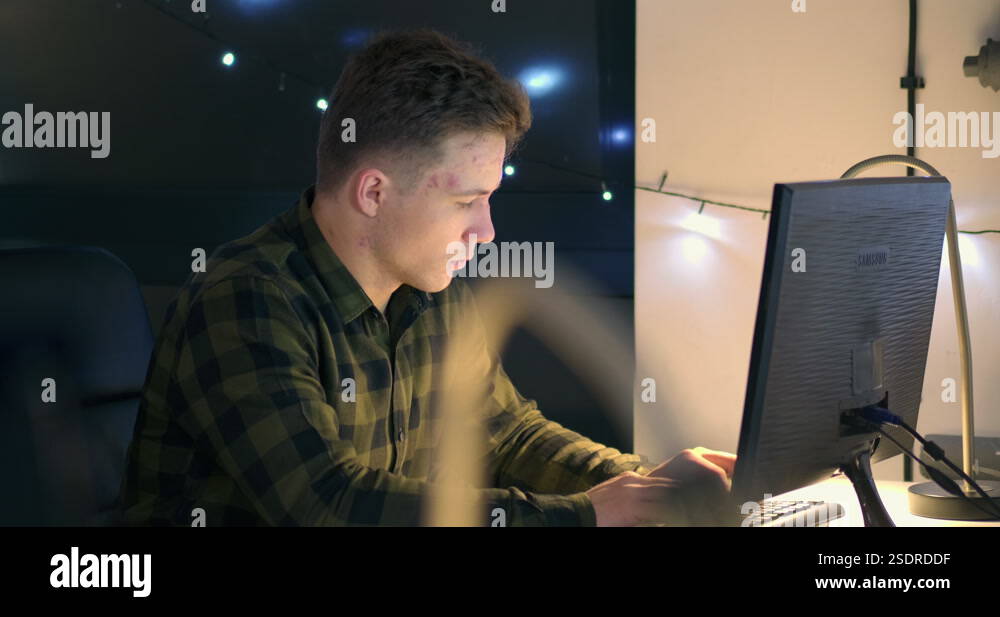 Men working on computer at desk at night Stock Video Footage - Alamy