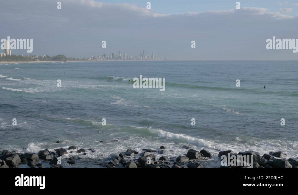 Perfect Sea Waves With Surfers - Suburb Cityscape Against Cloudscape At ...