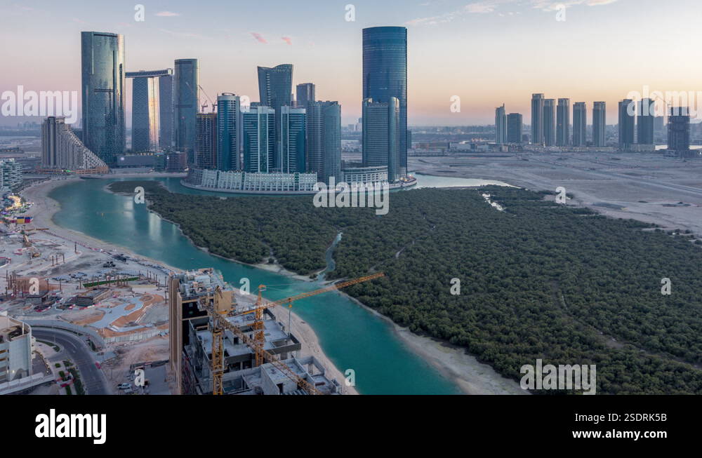 Buildings on Al Reem island in Abu Dhabi day to night timelapse from ...