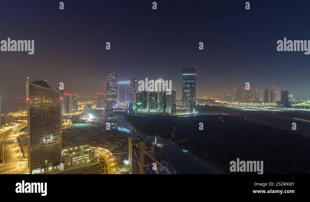 Buildings on Al Reem island in Abu Dhabi night timelapse from above ...