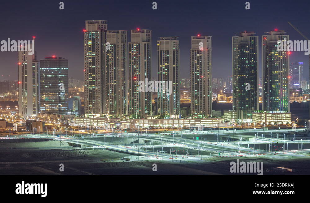 Buildings on Al Reem island in Abu Dhabi night timelapse from above ...