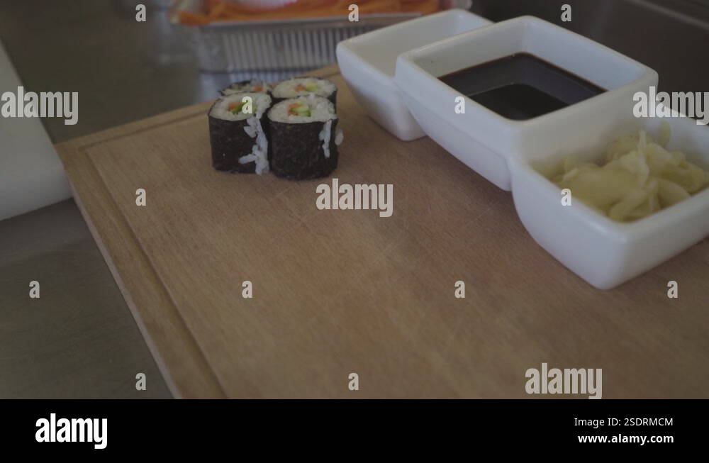 A chef is making sushi. The process of preparing an Asian sushi dish ...