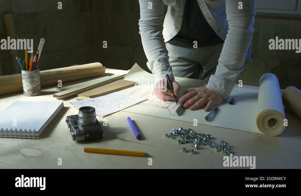 Designer, Architect, works with blueprints. Tools and office for the ...
