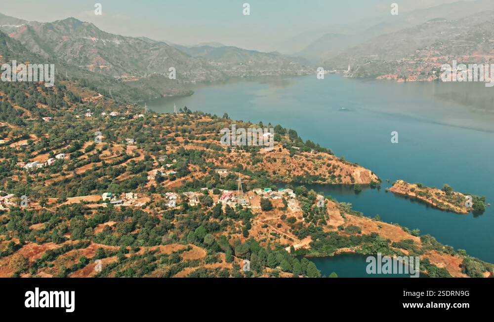 Aerial view of Tihari Dam in the middle of mountains, Uttrakhand, India ...