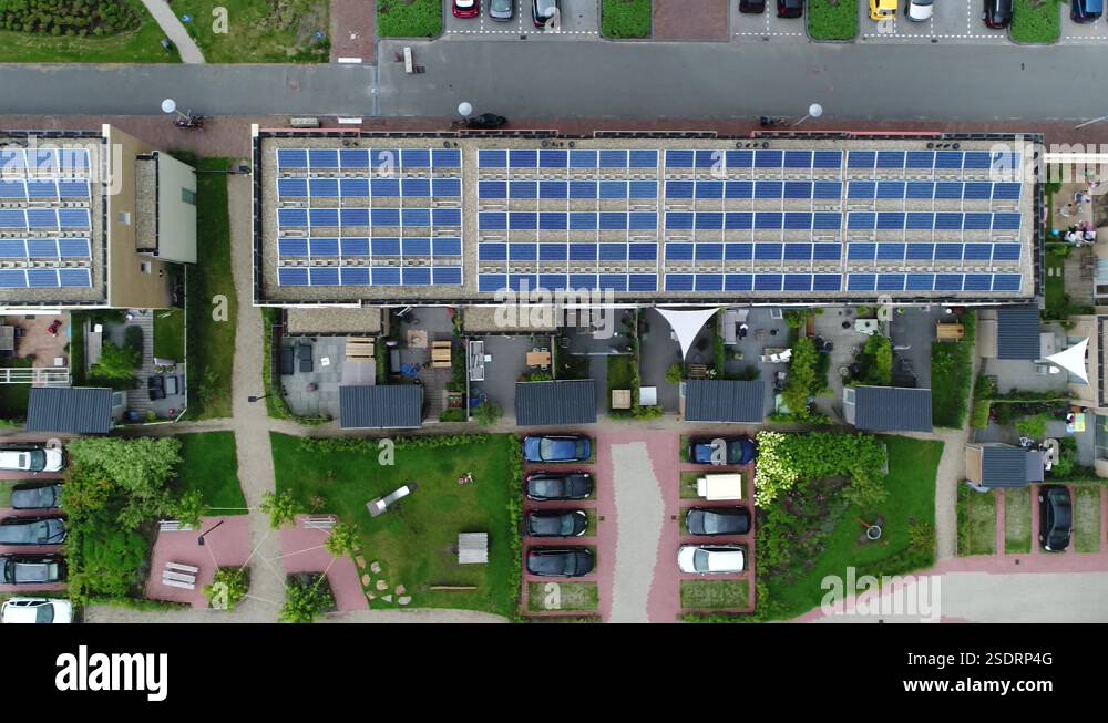 Aerial top down view of new built apartment complex with solar panels ...