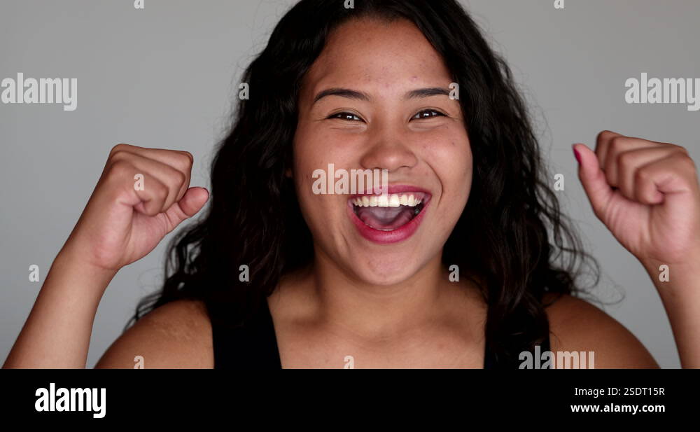 Excited happy hispanic girl cheering success reaction to great news Stock Video Footage - Alamy