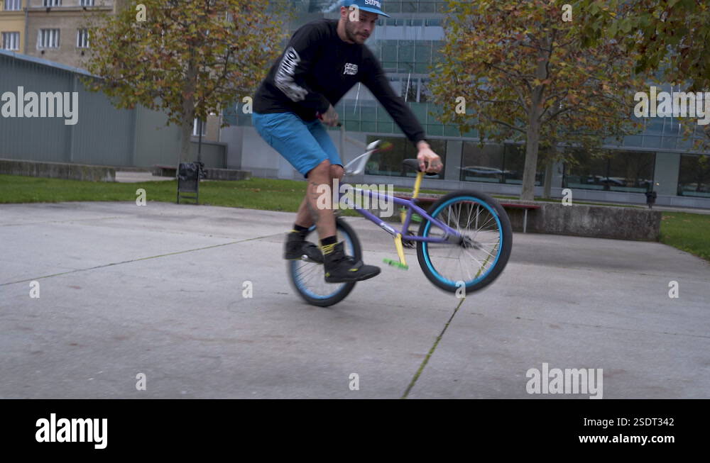 Guy riding a BMX bike in a skatepark,doing Spinning Steamroller Stock ...