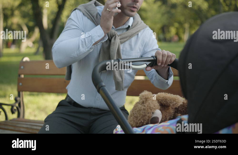 Unrecognizable young father consulting someone on the phone. Desperate ...