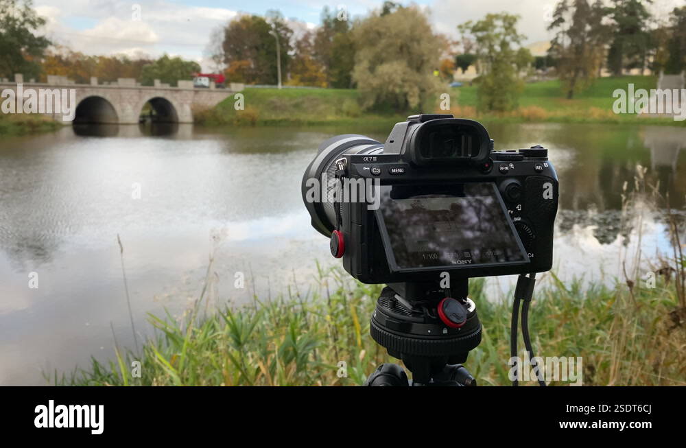 Using digital camera to capture video outdoors Sony a7 III on tripod in ...