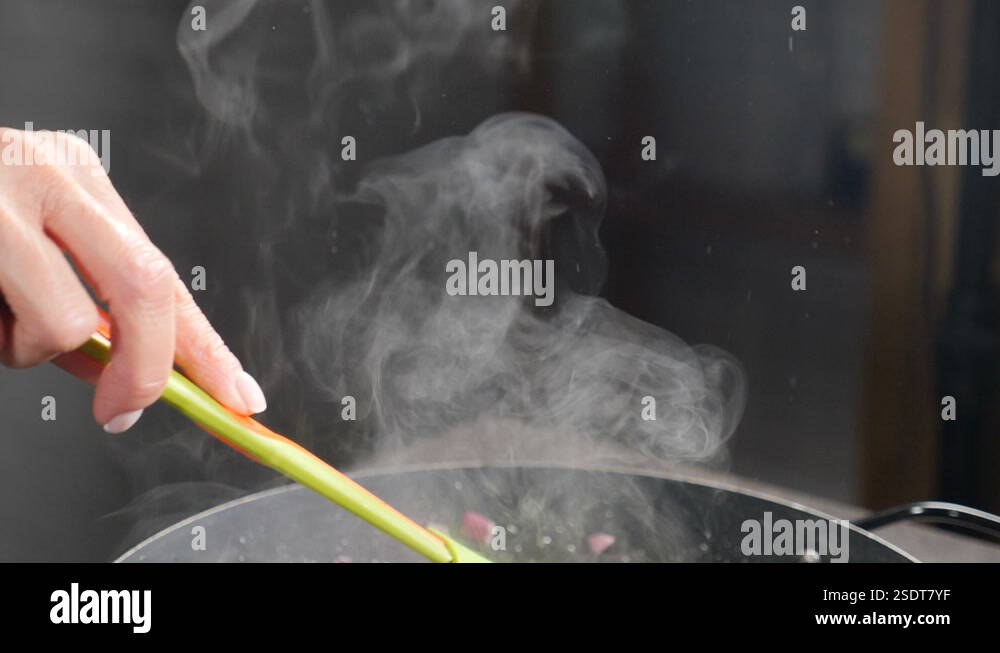 Steam or vapour rising up from cooking. Slow motion. Cooking and ...