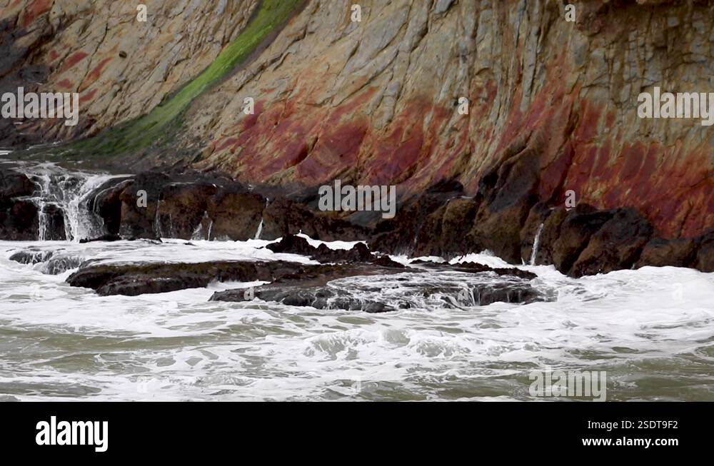 Water Crashing Into Rocks At Beach Stock Video Footage - Alamy