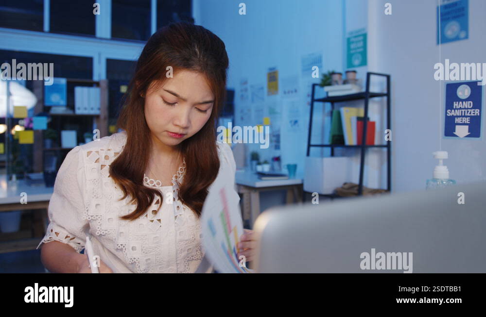 Freelance Asia women using laptop hard work at new normal home office ...