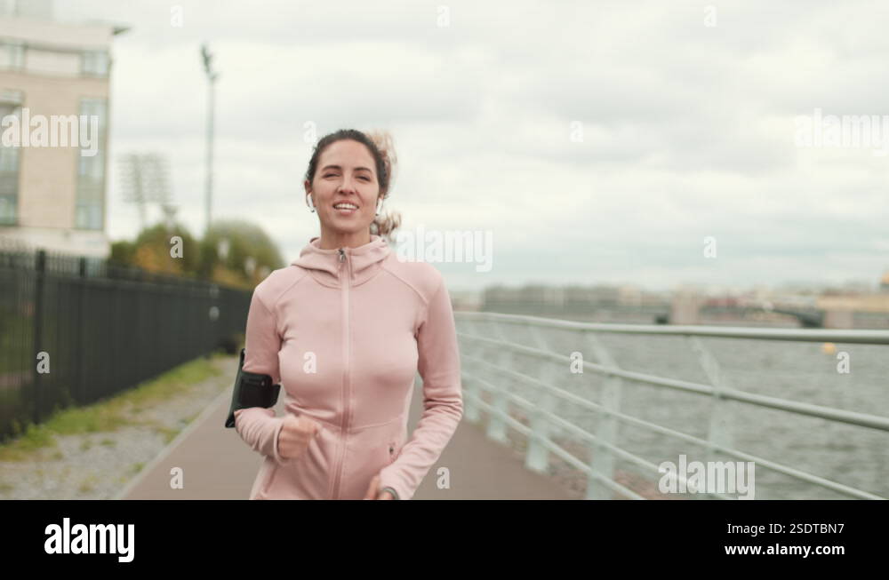 Female Fitness Blogger Running along Embankment Stock Video Footage - Alamy