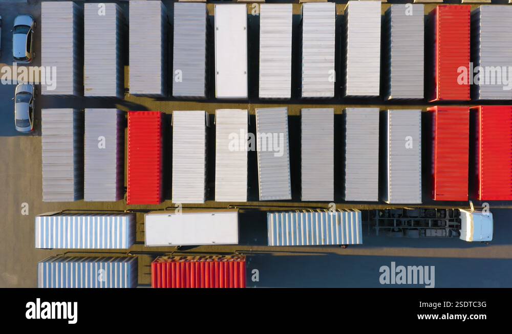 Cargo containers are at the warehouse`s parking lot in a logistics park ...