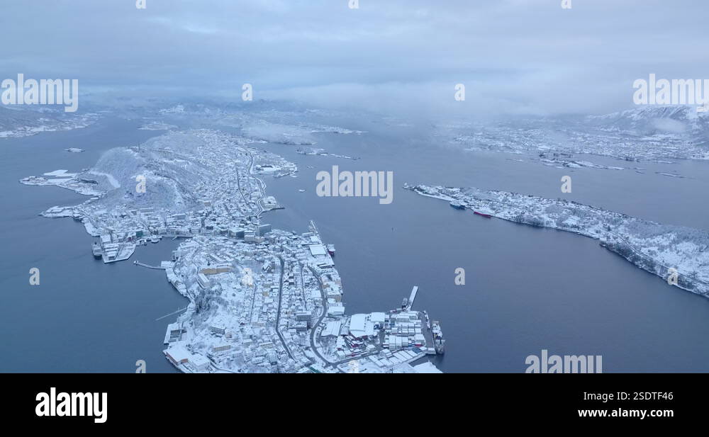 Beautiful, high altitude, drone footage that shows downtown Alesund ...