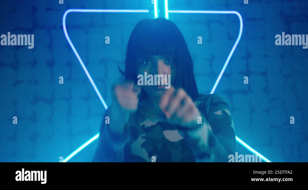 Cyberpunk lady moves fists practicing boxing movements Stock Video ...