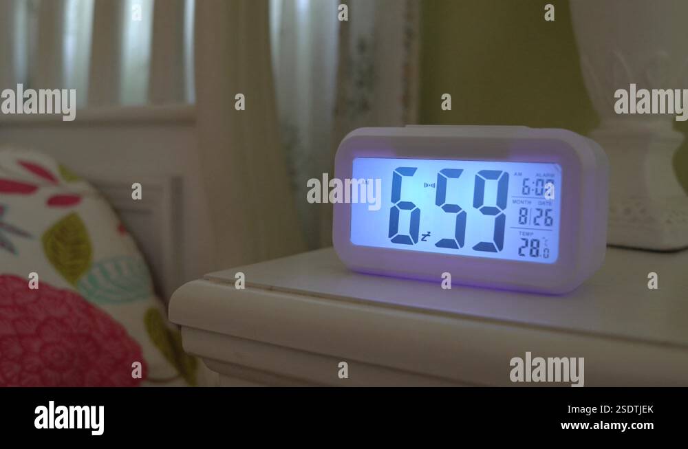 Digital clock, time changes from 6:59 to 7 am. Alarm clock or overslept ...