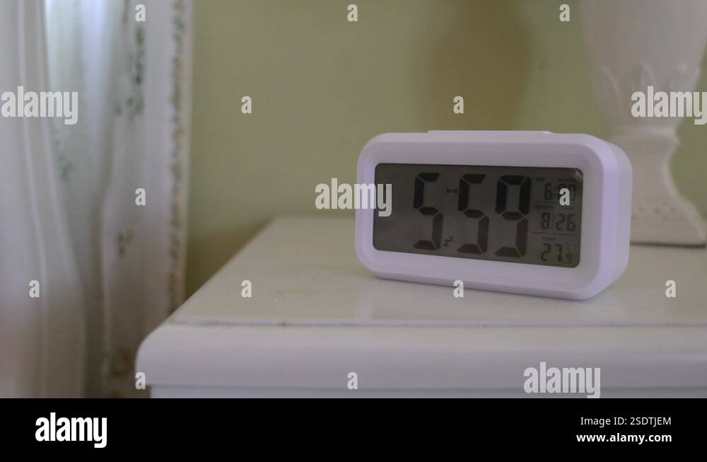 Alarm clock, time changes from 5:59 to 6am. Time to wake up concept ...