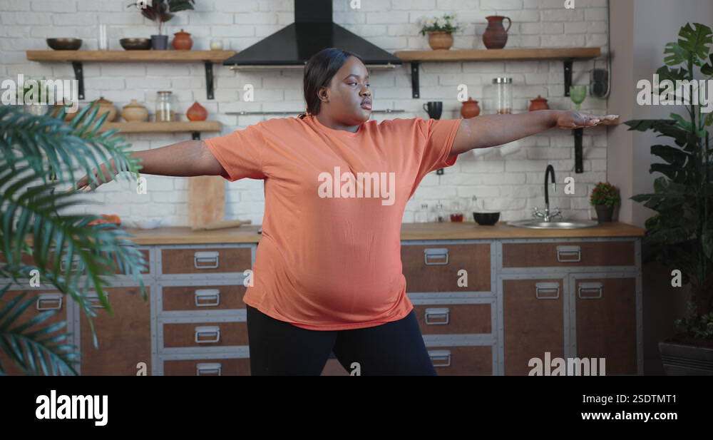 Body positive model improves and practices yoga poses Stock Video ...