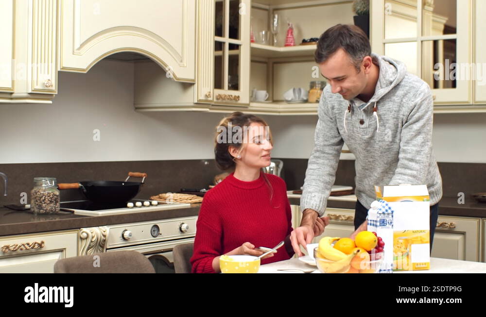 CHISINAU, MOLDOVA - SEPTEMBER 25, 2018: A smiling couple on a kitchen ...