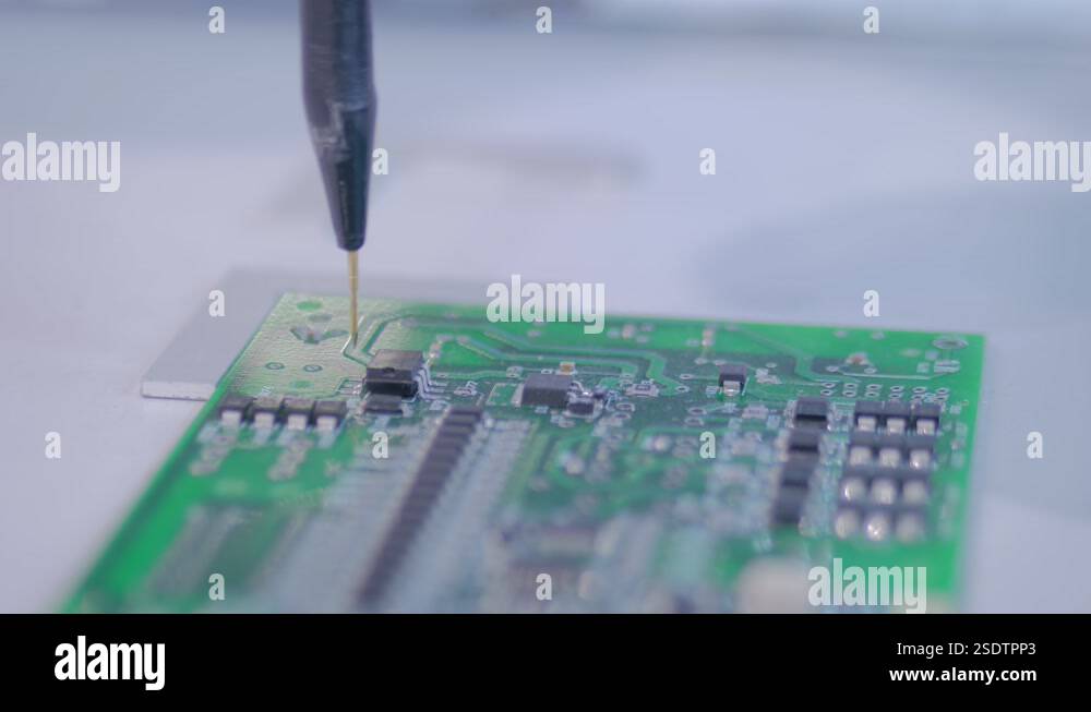 Automatic manipulator with dispenser needle during work with SMT pcb ...